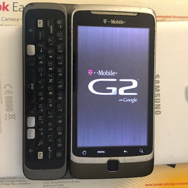 VINTAGE T~MOBILE G2 SLIDE CELL PHONE::W/CHARGER :: TESTED::POWERS UP ...